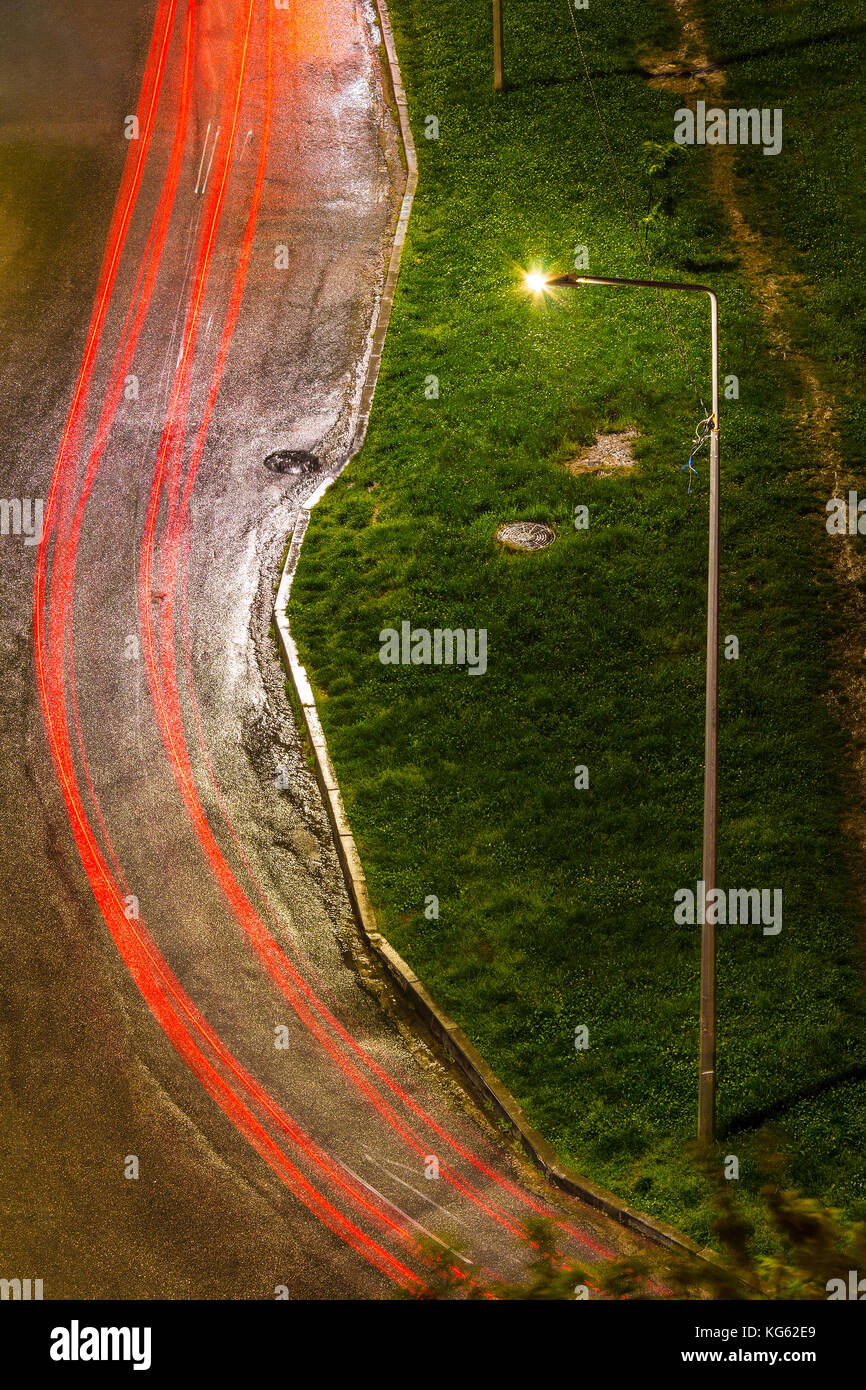 Aerial view of the luminous streetlight and the road with light trails ...