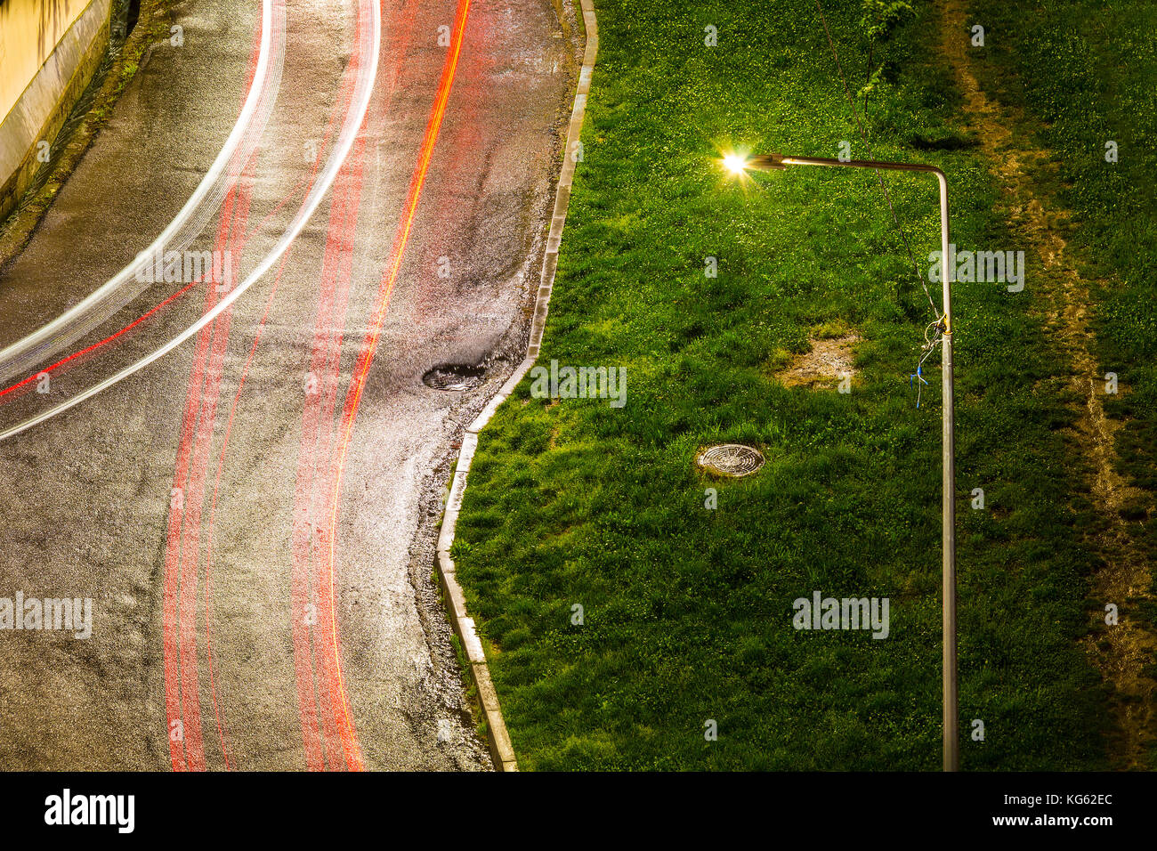 Aerial view of the luminous streetlight and the road with light trails ...