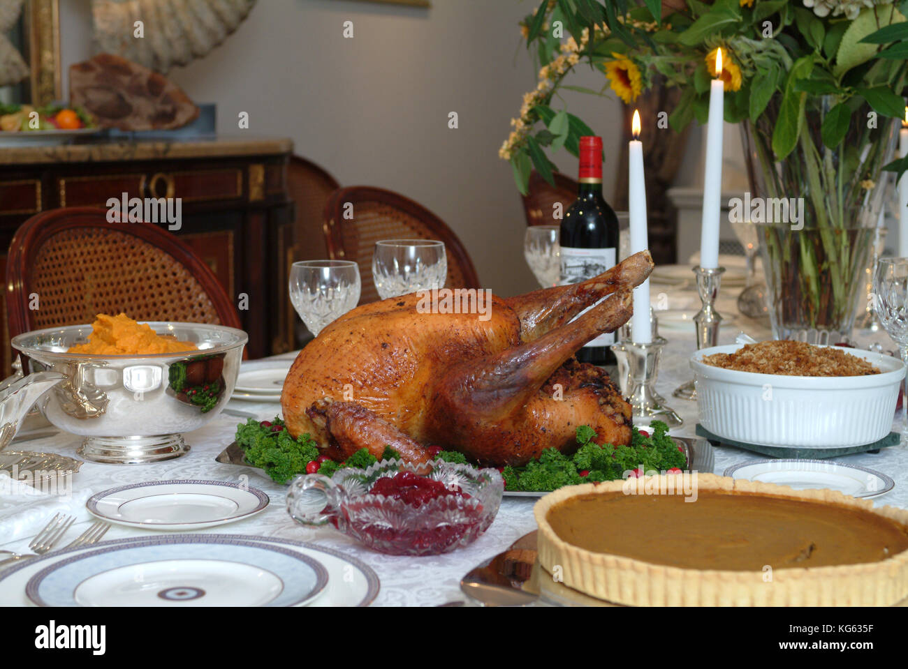 Thanksgiving family dinner table with turkey and pumpkin pie in London ...