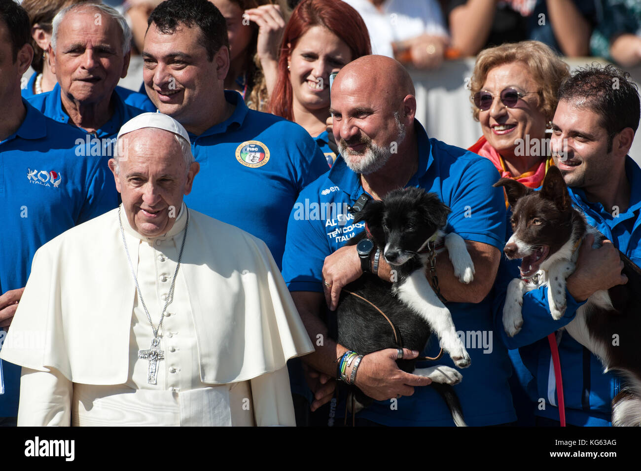Pope Francis poses with faithful holding dogs during his Wednesday ...