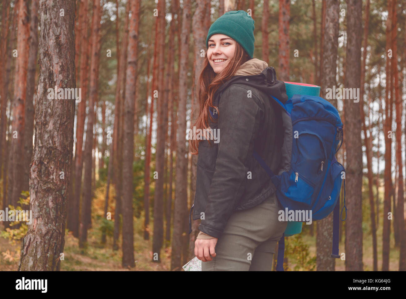 Hiking woman portrait smiling happy in forest. Female hiker girl ...