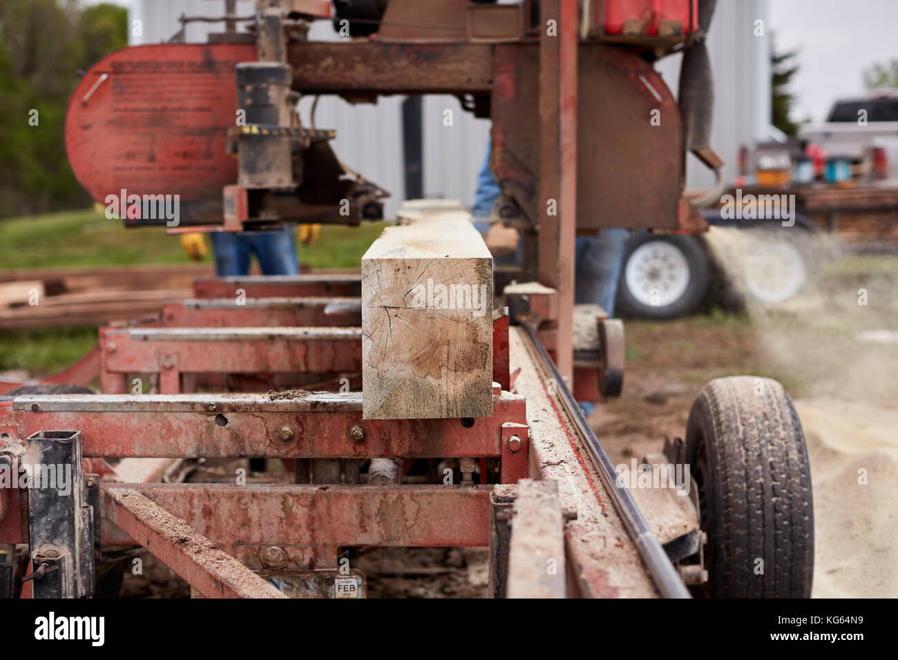 Milling lumber at a sawmill using a portable wheeled milling machine or ...