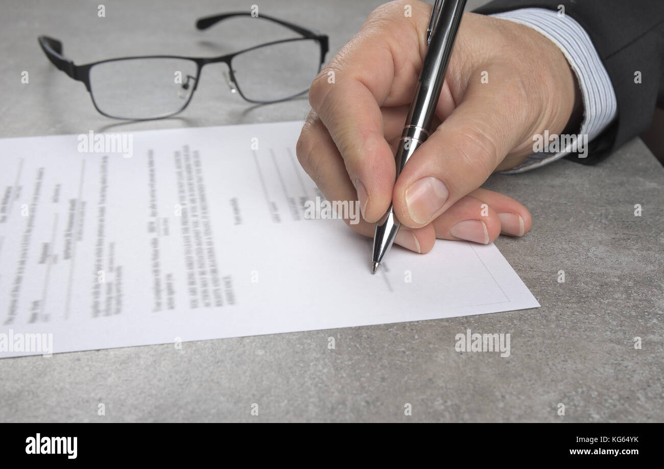 Business man signing a contract making a deal, classic business concept ...