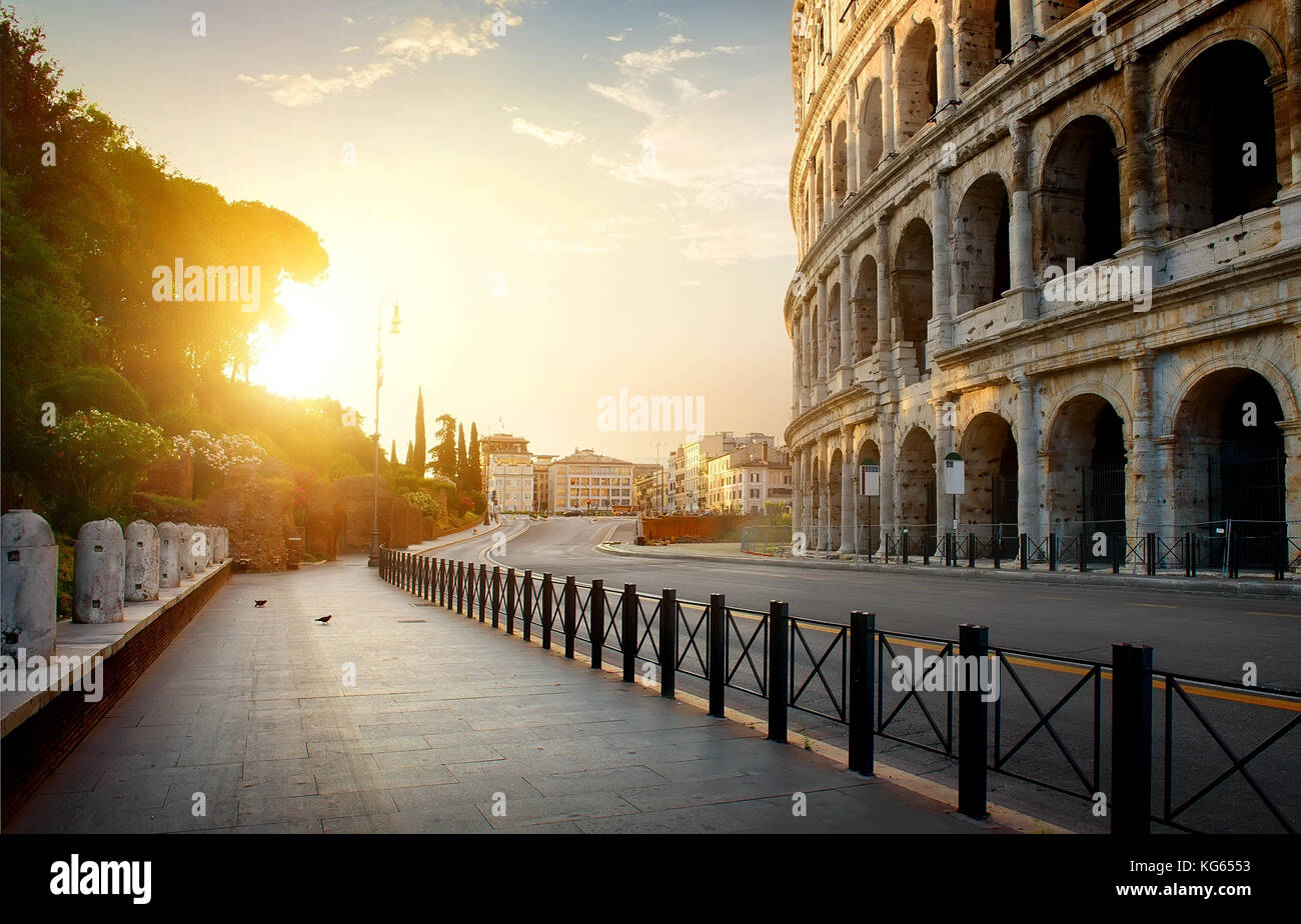 Colosseum and road at morning sunlight in Rome, Italy Stock Photo - Alamy