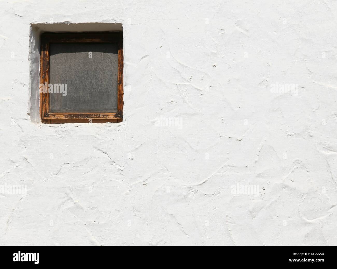 little square window and the white wall of a mediterranean house Stock ...