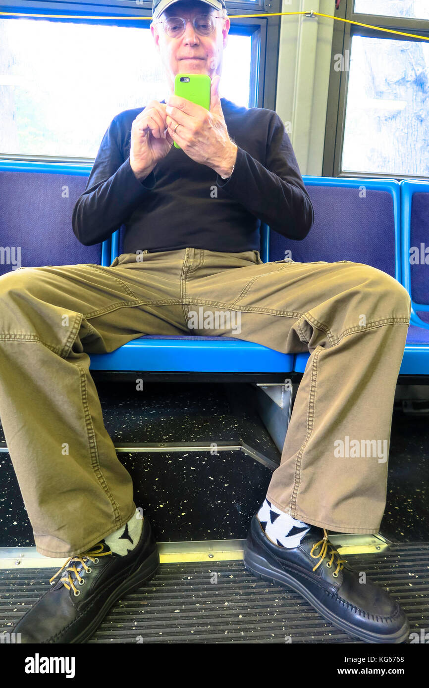 Man sitting legs spread hi-res stock photography and images - Alamy