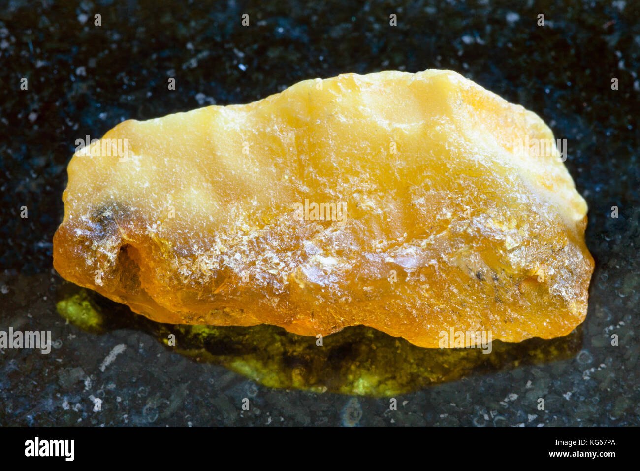 macro shooting of natural mineral rock specimen - rough baltic Amber ...