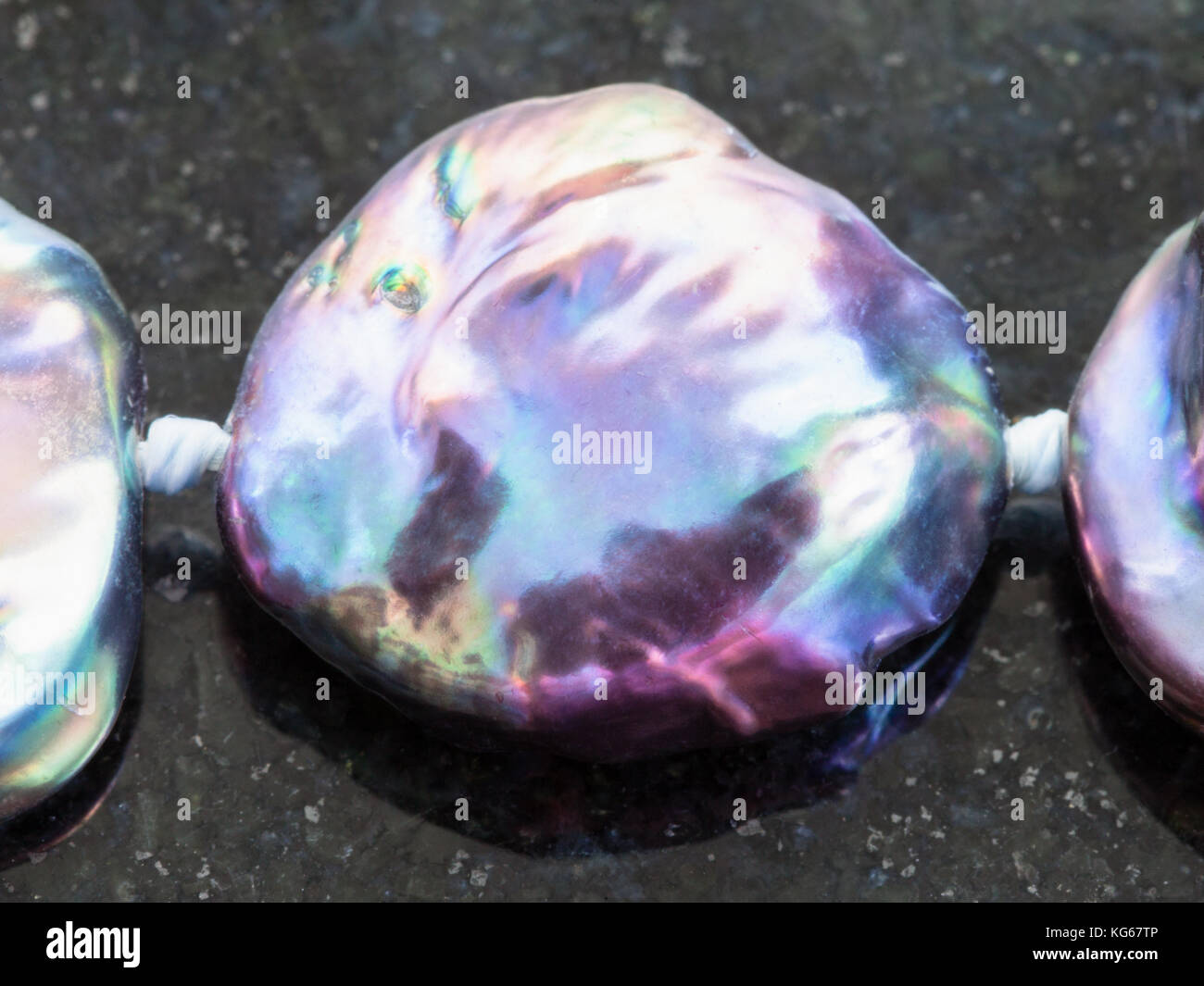 macro shooting of natural mineral rock specimen - bead from Abalone ...