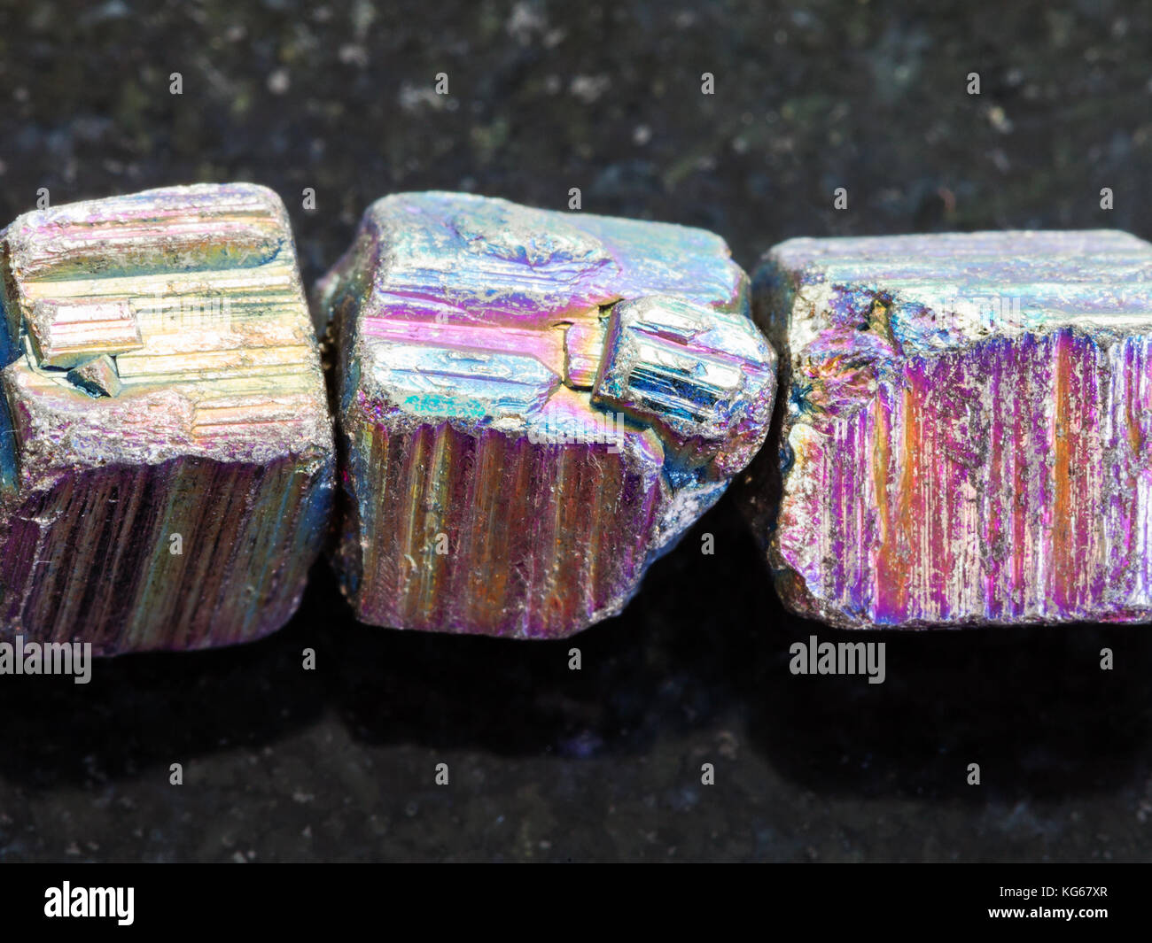 macro shooting of natural mineral rock specimen - beads from iridescent ...