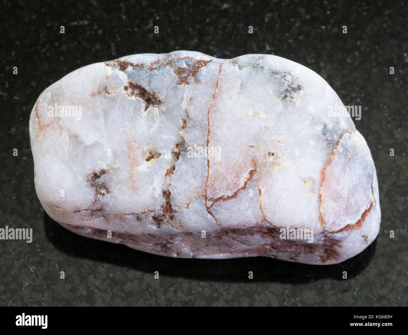 macro shooting of natural mineral rock specimen - marble piece on dark ...
