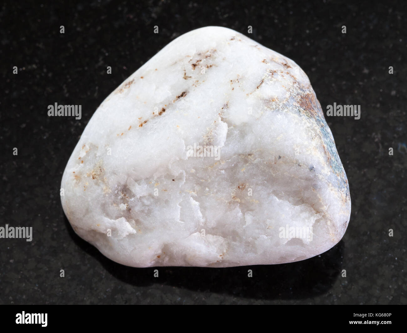 macro shooting of natural mineral rock specimen - white marble pebble ...