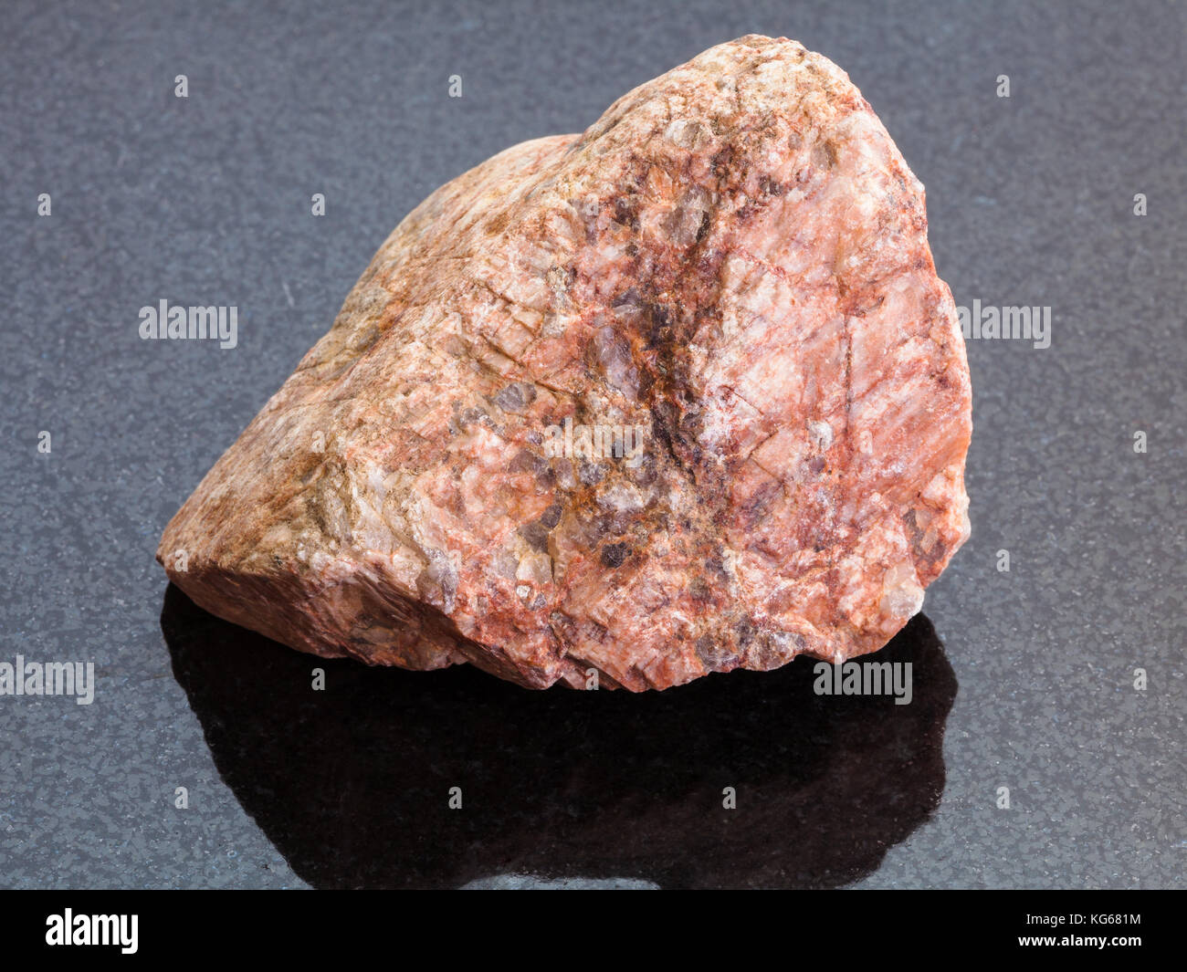 macro shooting of natural mineral rock specimen - raw pink Granite ...