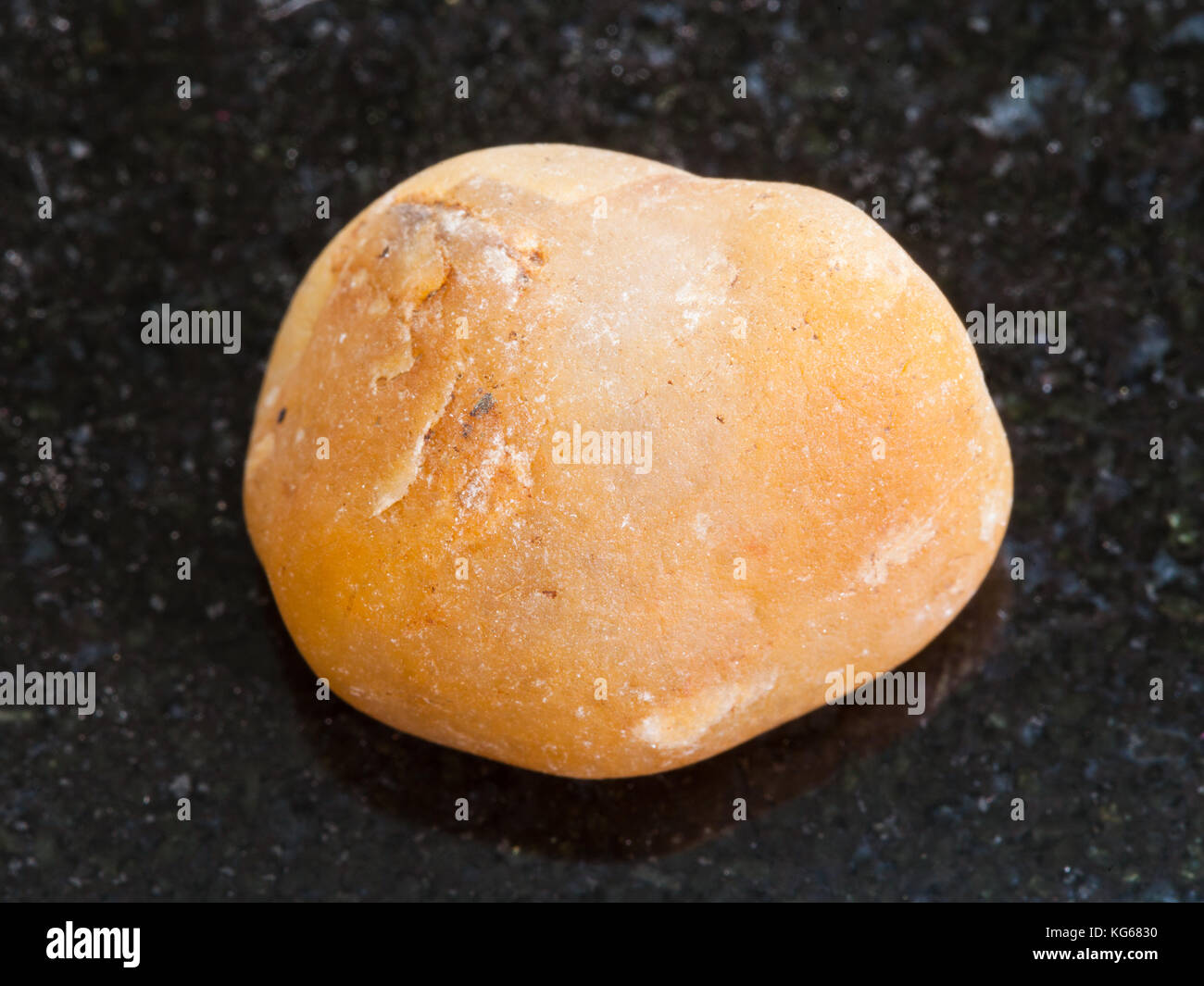 macro shooting of natural mineral rock specimen - tumbled yellow ...