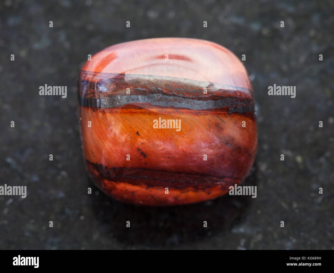 macro shooting of natural mineral rock specimen - polished jaspilite ...