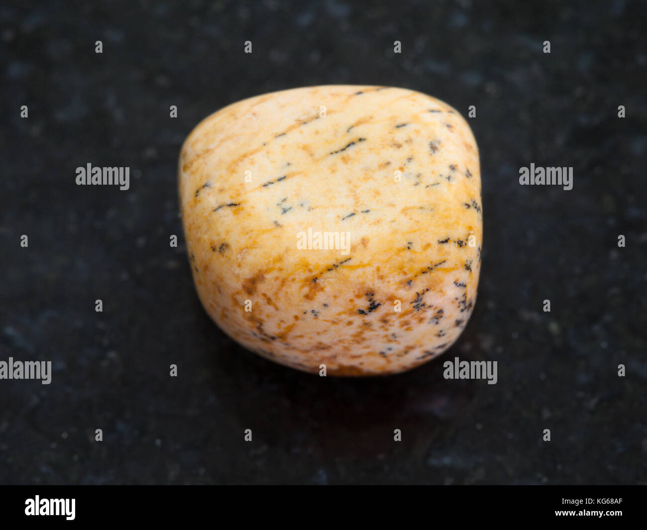 macro shooting of natural mineral rock specimen - tumbled sandy Jasper ...