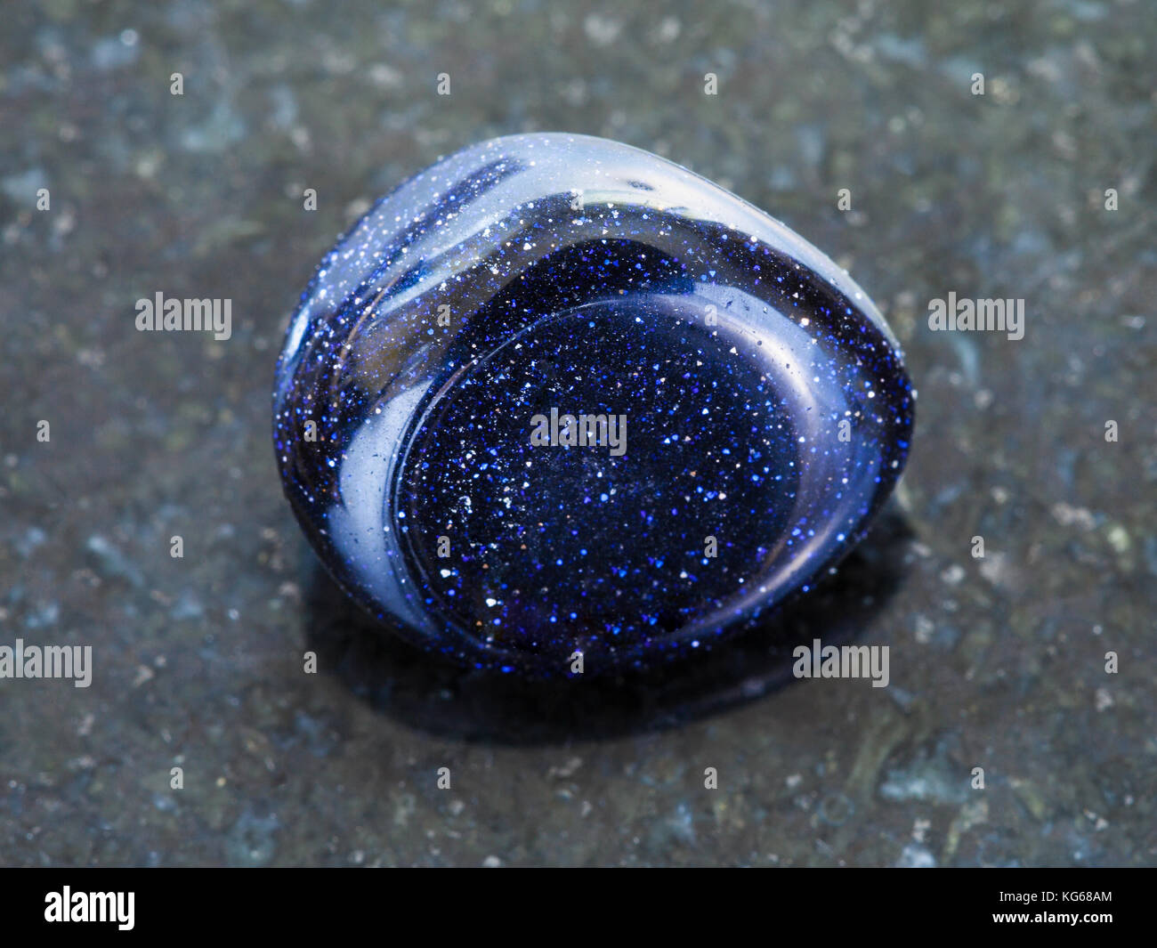 macro shooting of mineral rock specimen - polished blue goldstone ...
