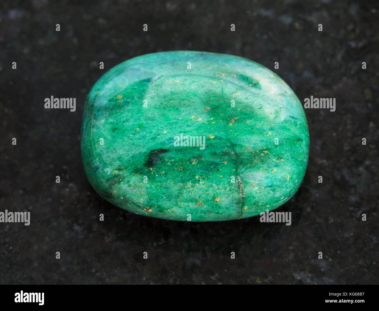 macro shooting of natural mineral rock specimen - polished green beryl ...