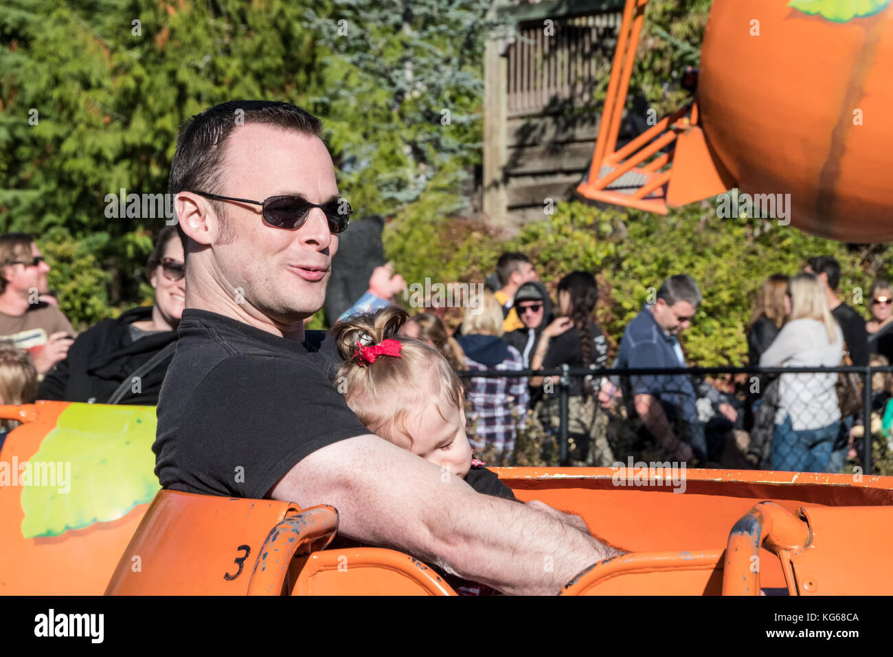 Mike taking Lily on a carnival ride at Remlinger Farms, Carnation ...
