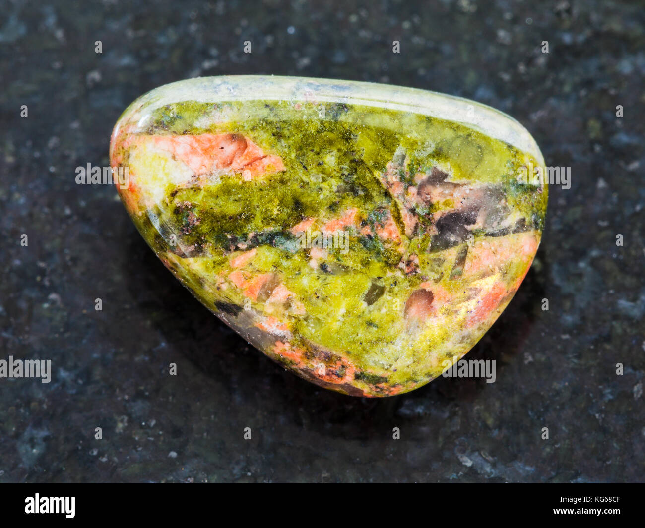 macro shooting of natural mineral rock specimen - tumbled Unakite ...