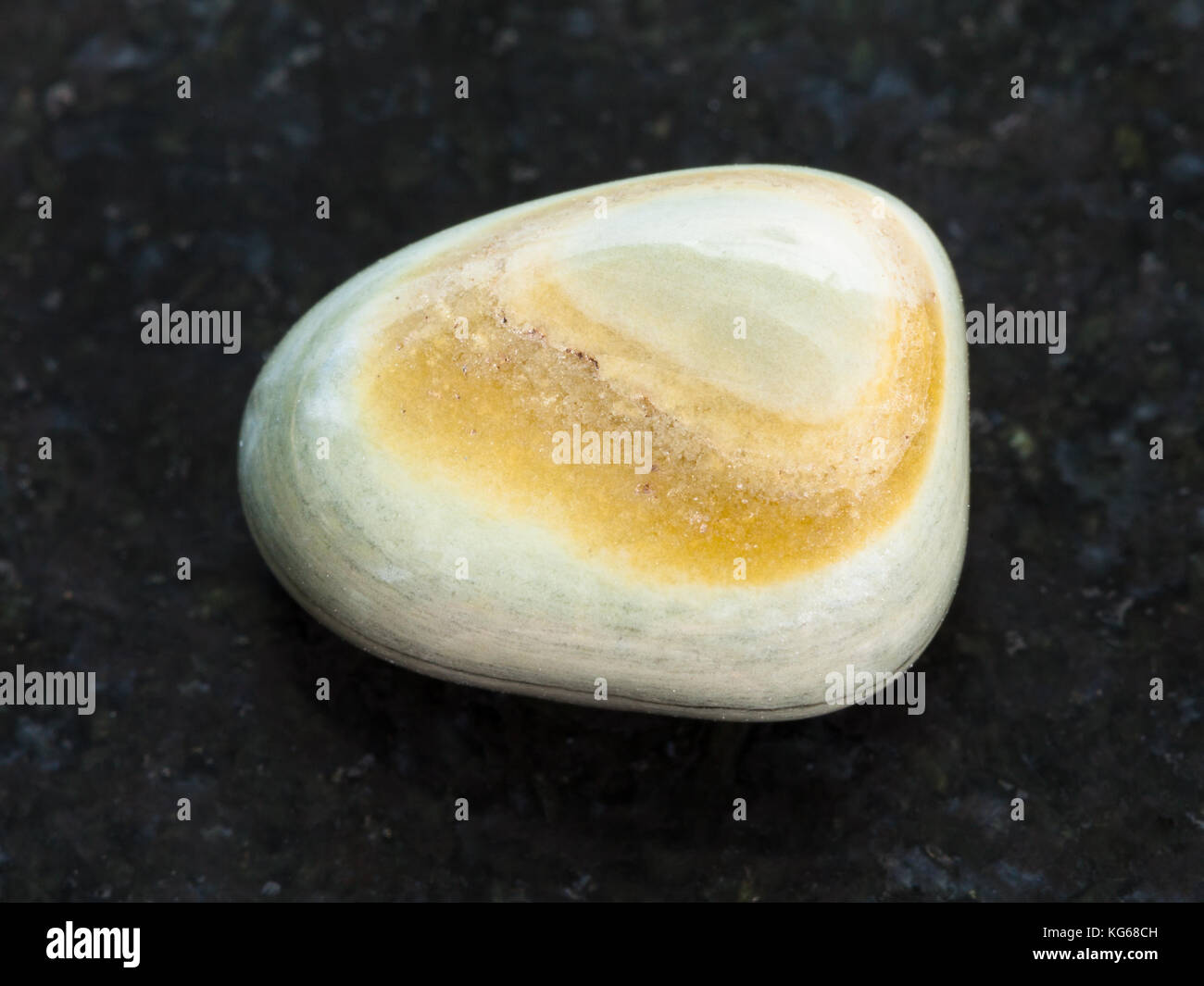 macro shooting of natural mineral rock specimen - tumbled gray Agate ...