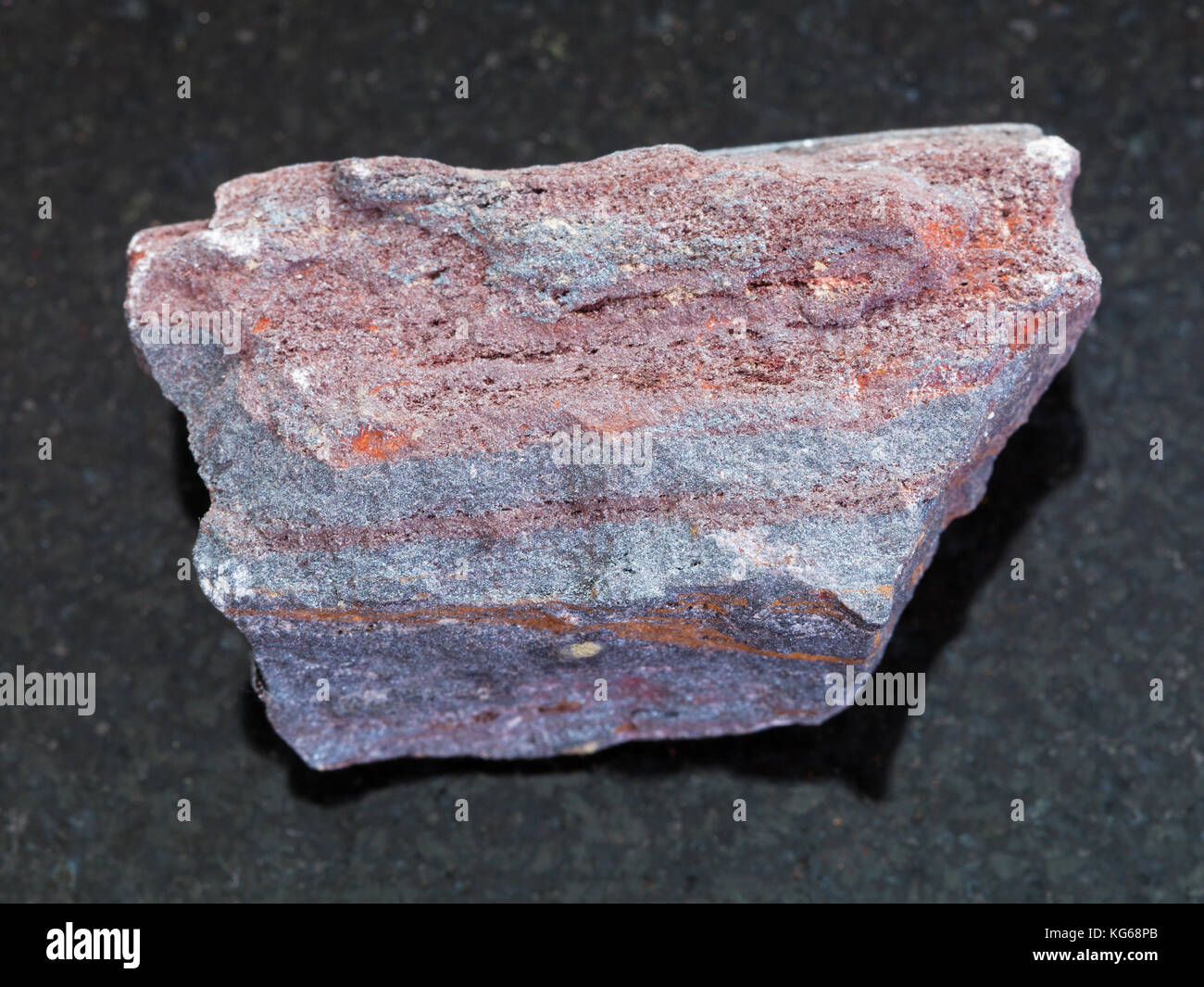 macro shooting of natural mineral rock specimen - raw jaspilite ...