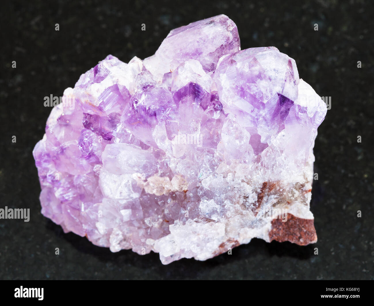 macro shooting of natural mineral rock specimen - raw Amethyst crystal ...