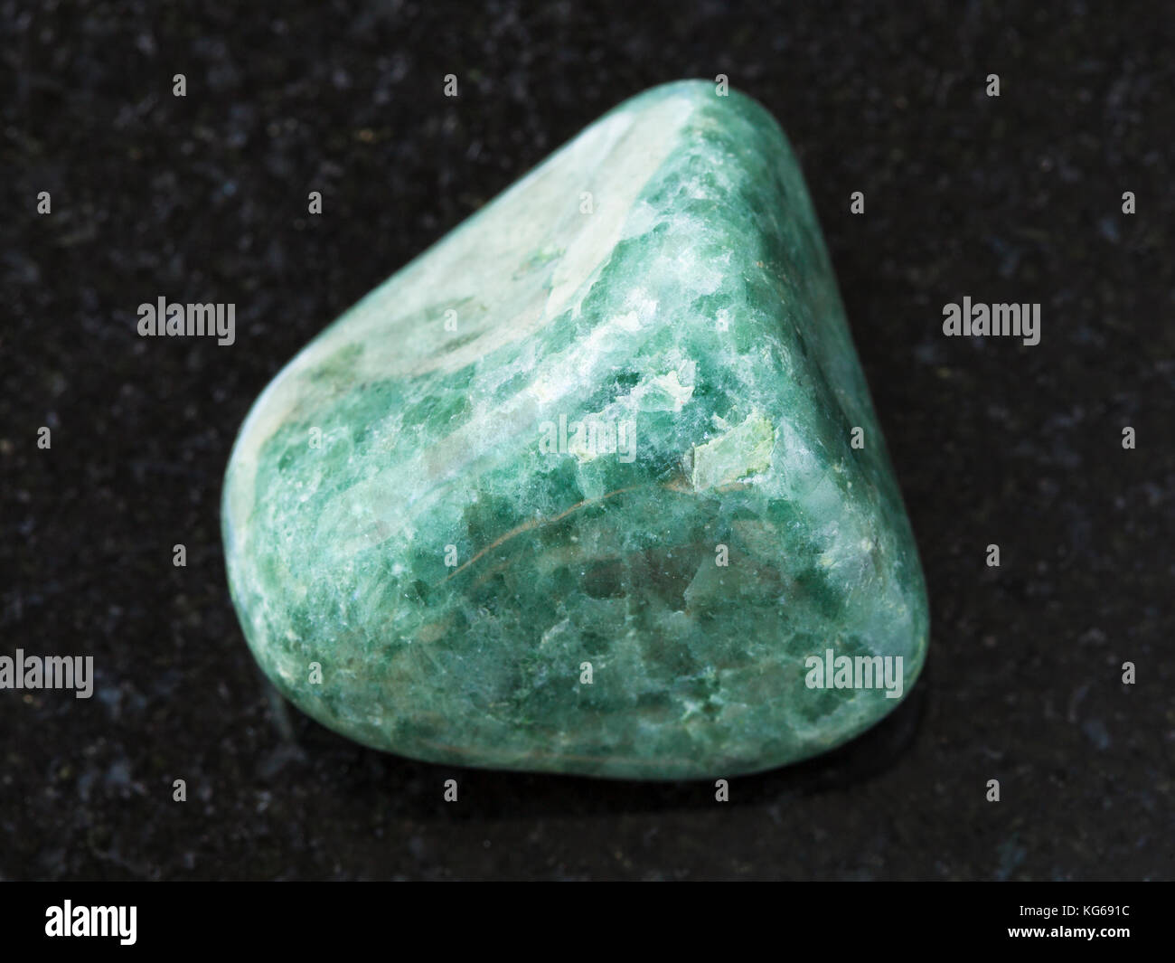 macro shooting of natural mineral rock specimen - polished green ...