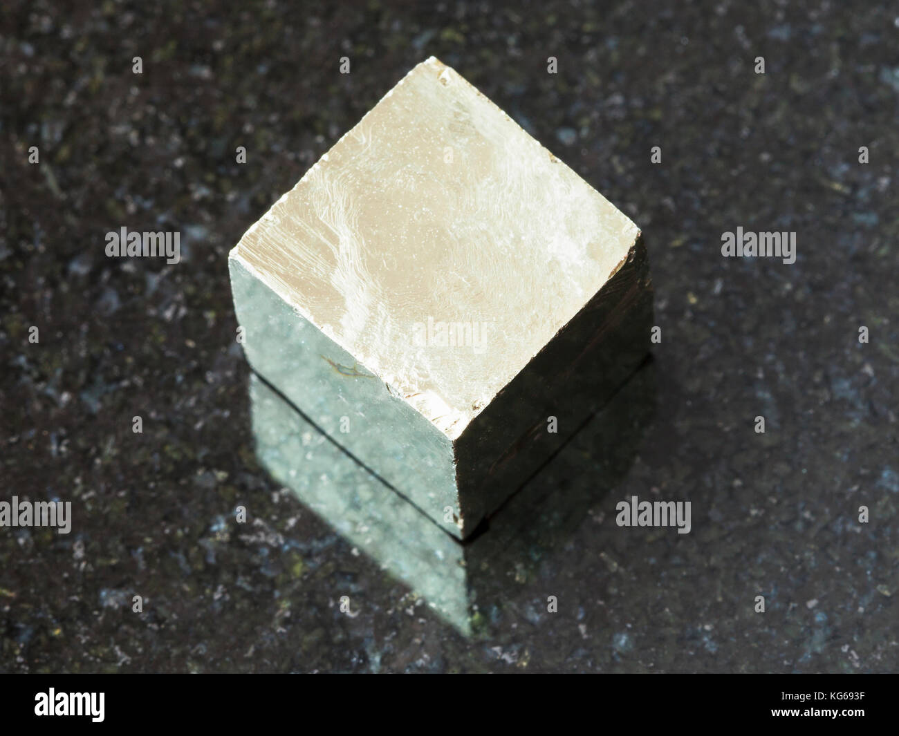 macro shooting of natural mineral rock specimen - raw pyrite crystal on ...