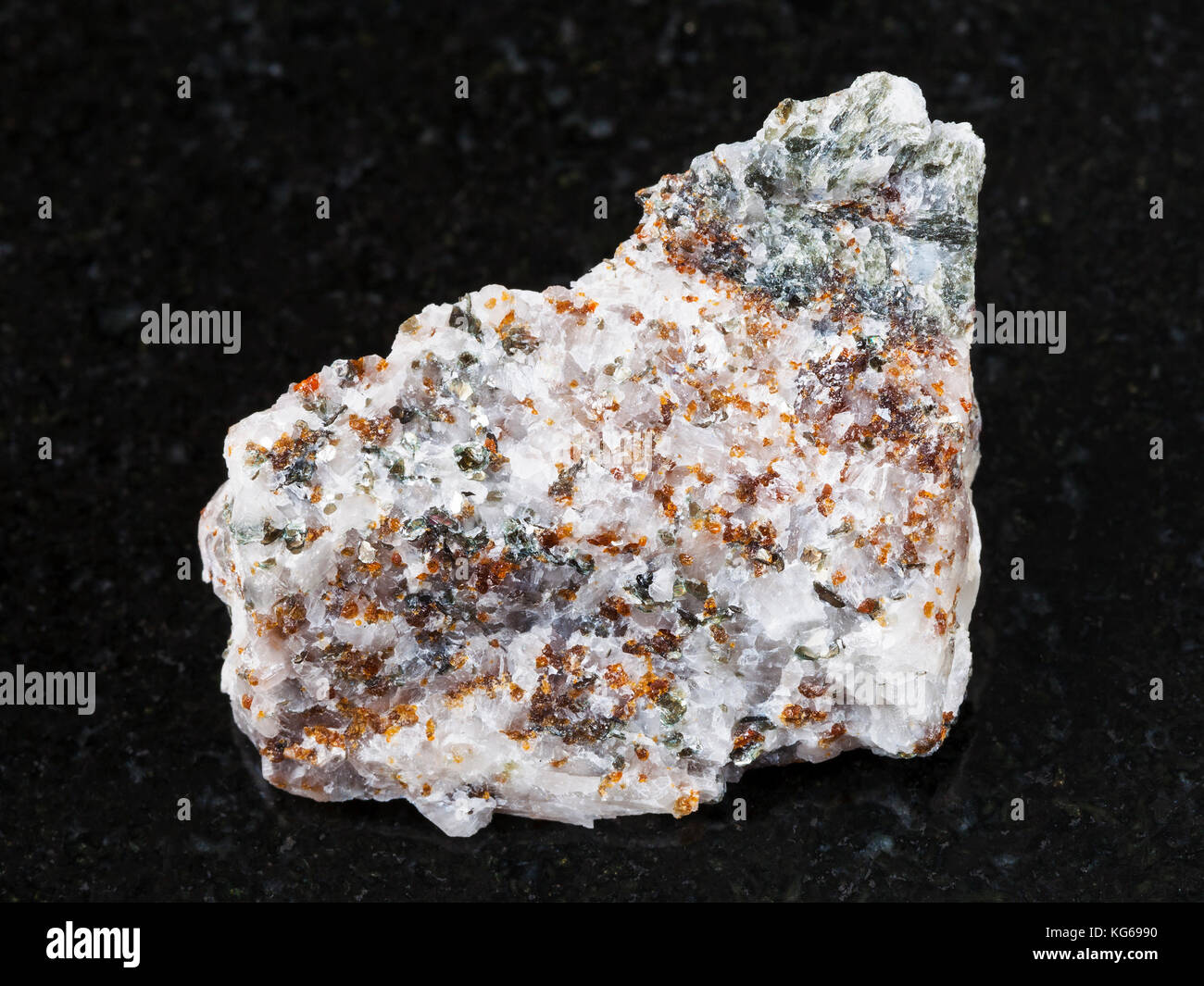 macro shooting of natural mineral rock specimen - brown chondrodite and ...