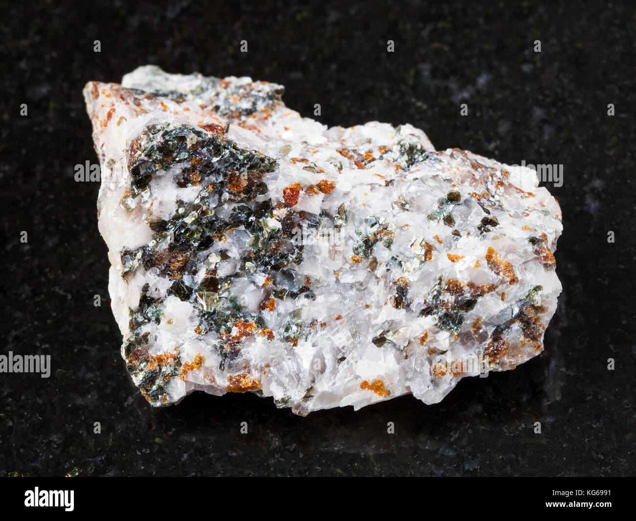 macro shooting of natural mineral rock specimen - brown chondrodite and ...