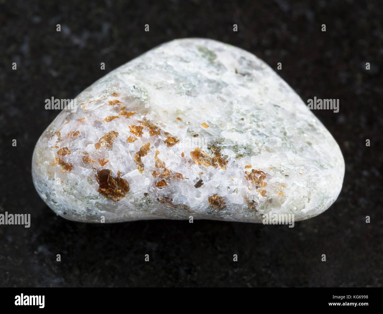 macro shooting of natural mineral rock specimen - brown chondrodite ...