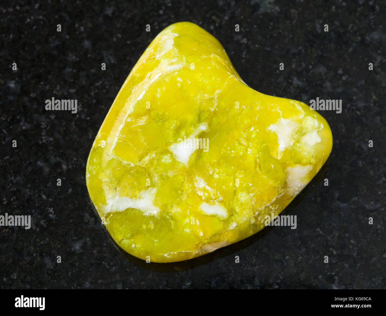 macro shooting of natural mineral rock specimen - polished yellow ...