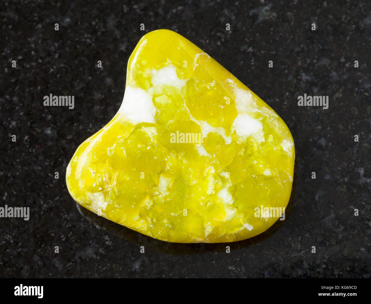 macro shooting of natural mineral rock specimen - tumbled yellow ...