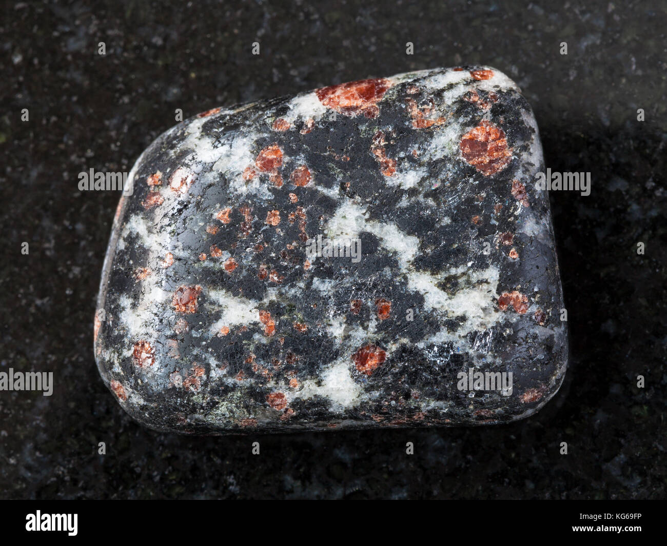 macro shooting of natural mineral rock specimen - red Garnet crystals ...