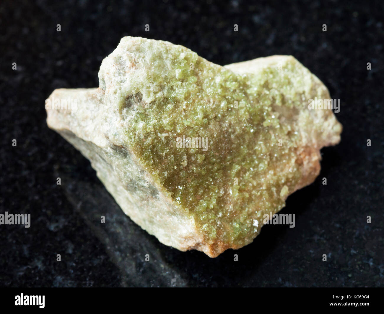 macro shooting of natural mineral rock specimen - green Vesuvianite ...