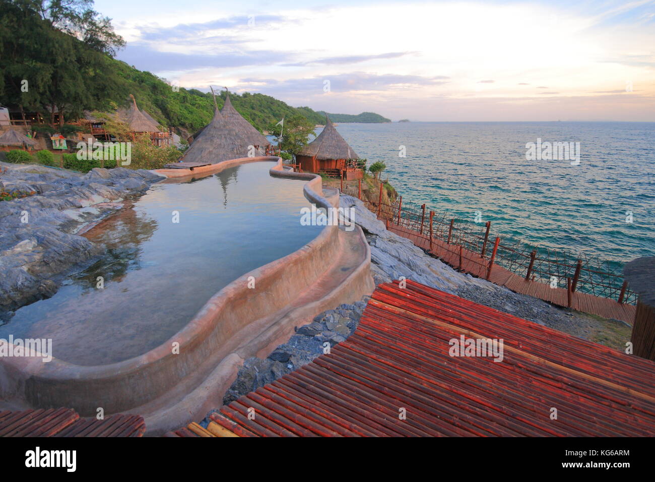 cliff edge swimming pool and day beds Stock Photo - Alamy