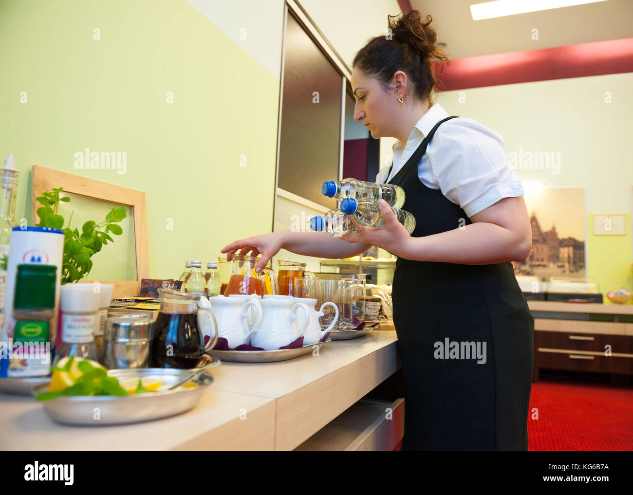 Waitress serving breakfast Stock Photo - Alamy