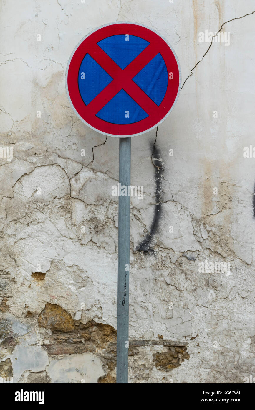 Road sign against rustic wall, North Cyprus Stock Photo - Alamy