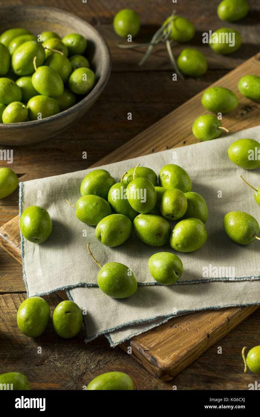 Raw Green Organic Fresh Olives Ready to Cook Stock Photo - Alamy