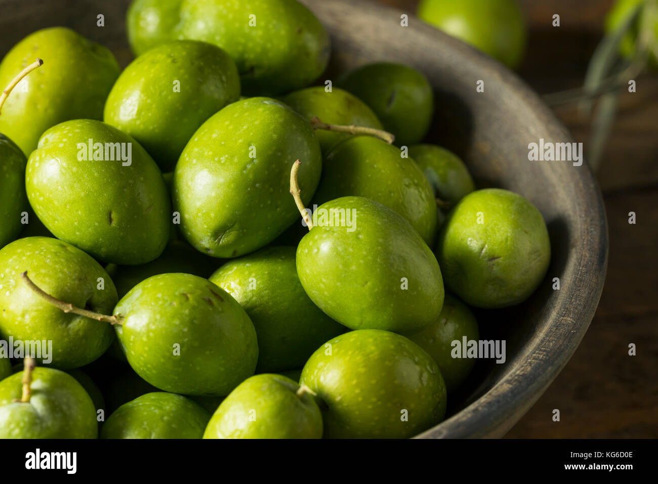 Raw Green Organic Fresh Olives Ready to Cook Stock Photo - Alamy