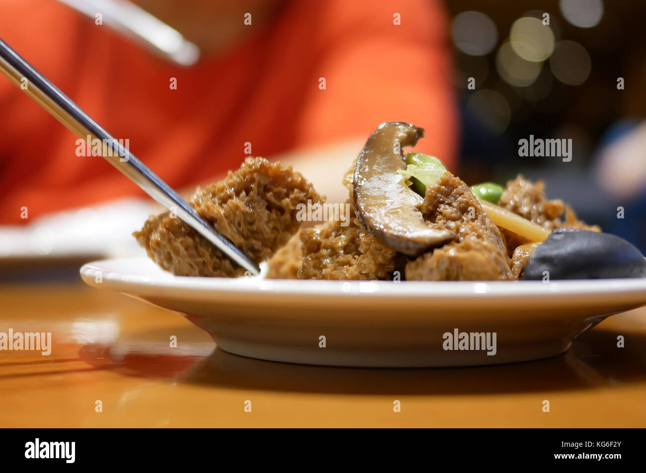 Motion of people eating appetizers on table inside Chinese restaurant ...