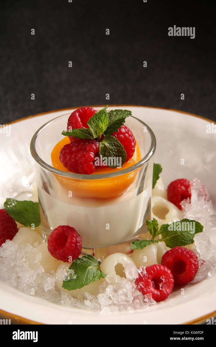 Almond Milk Pudding with Longan, Peach and Raspberry Stock Photo - Alamy