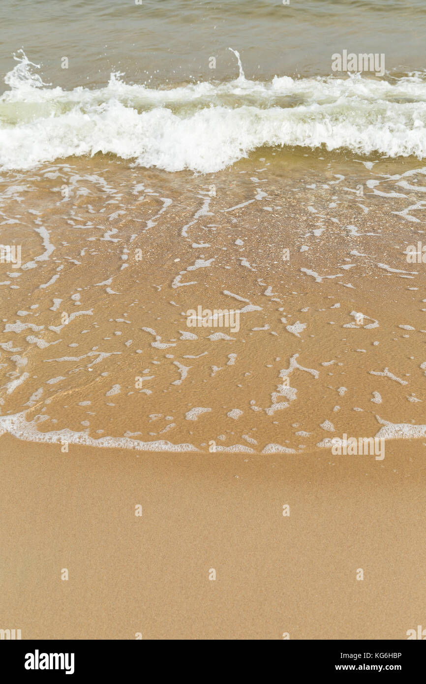 Smooth sandy beach and small wave on a sunny day in the summer Stock ...