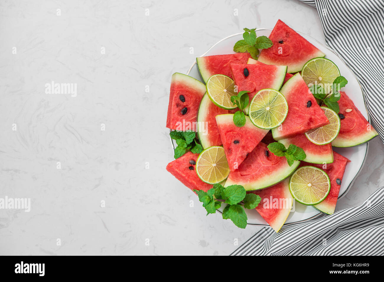 Fresh sliced watermelon on a plate in summertime Stock Photo - Alamy