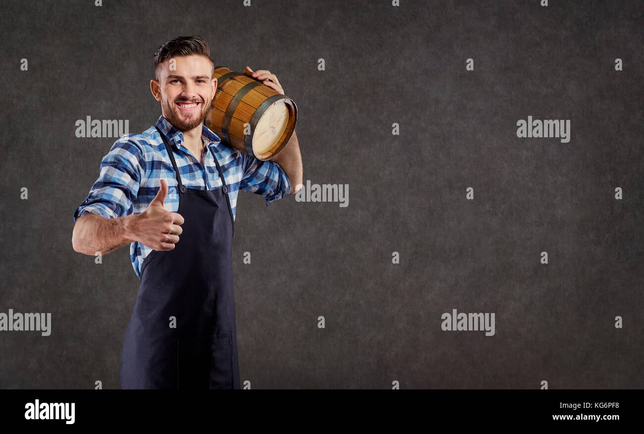 A brewer with a barrel in his hand against Stock Photo - Alamy