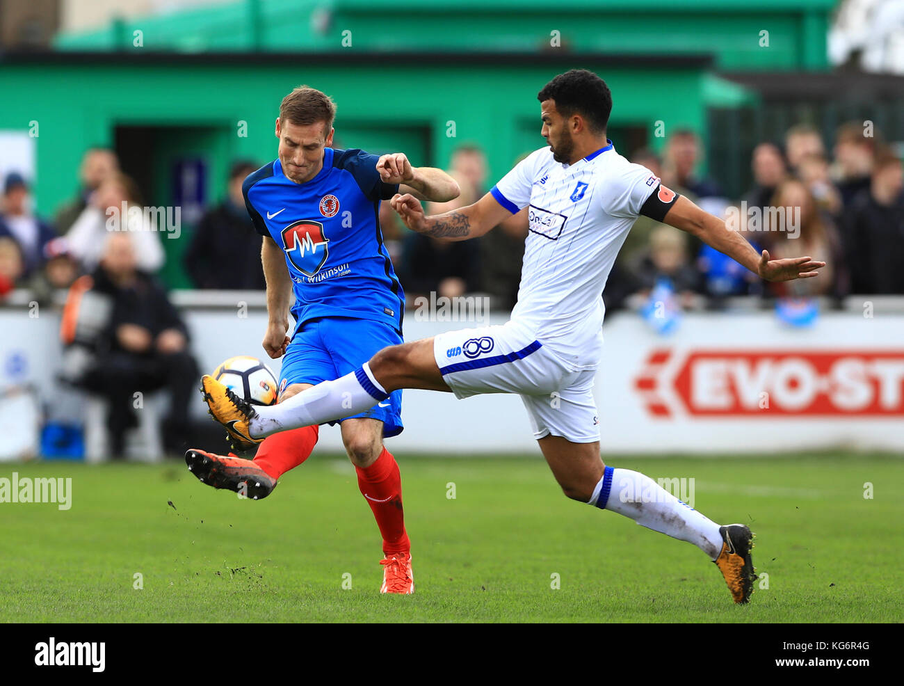 Shaw Lane AFC's Neil Austin (left) and Mansfield Town's Jacob Mellis ...