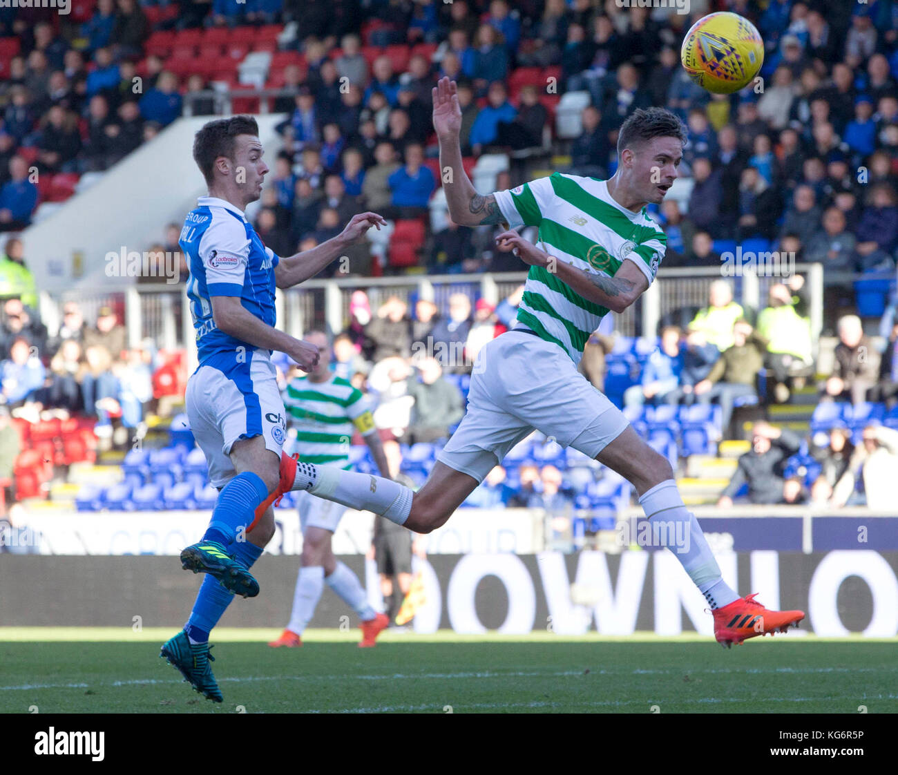 Celtic's Mikael Lustig (right) and St Johnstone's Stefan Scougall ...