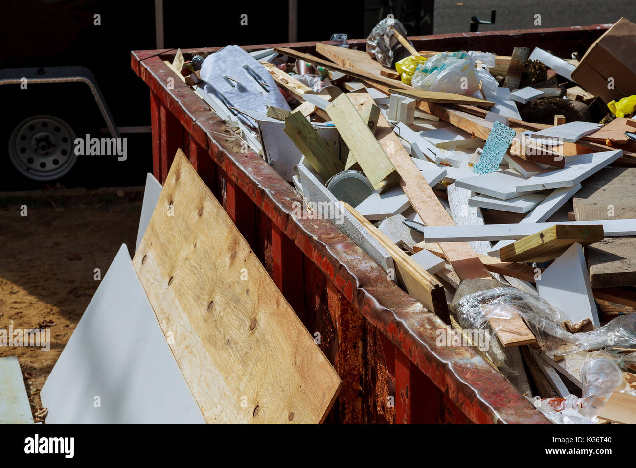 Dumpsters being full with garbage in a city. Dumpsters being full with ...