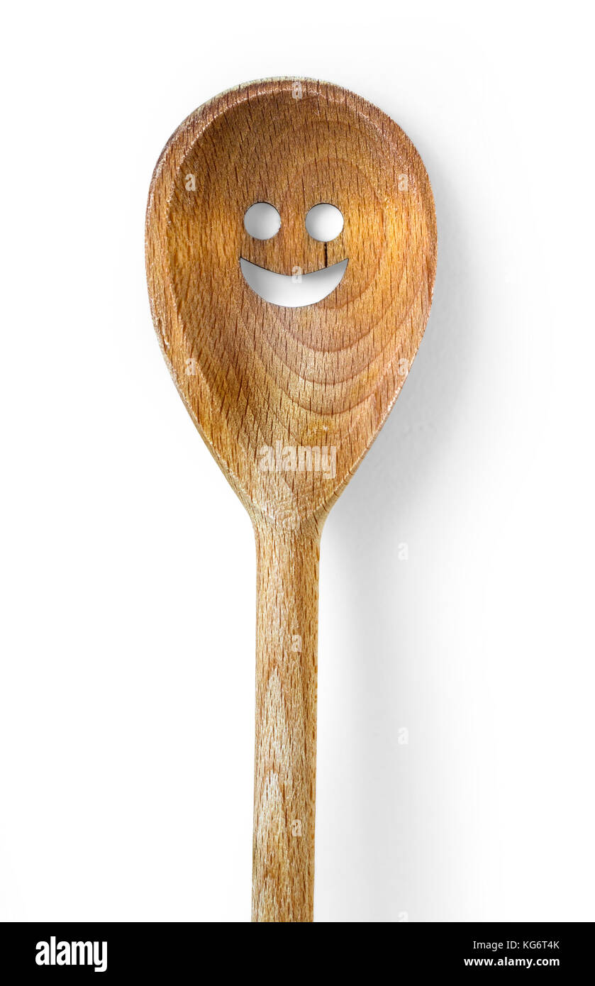 Wooden spoons with smile motif on white background. Wooden kitchen ...