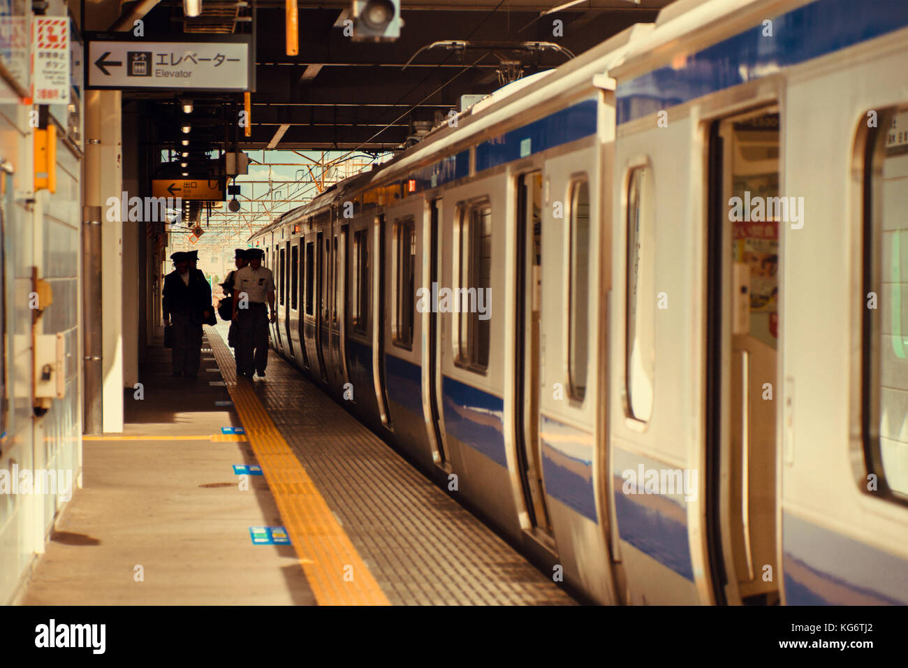 blue Japanese train conductors team going to work at the train station ...